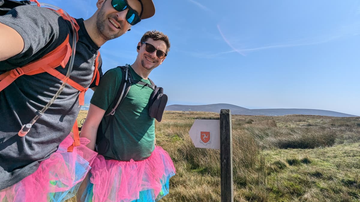 Friends walk the length of the Isle of Man with their legs tied ...